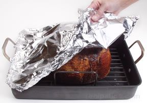 Do you cover a ham with foil to bake?