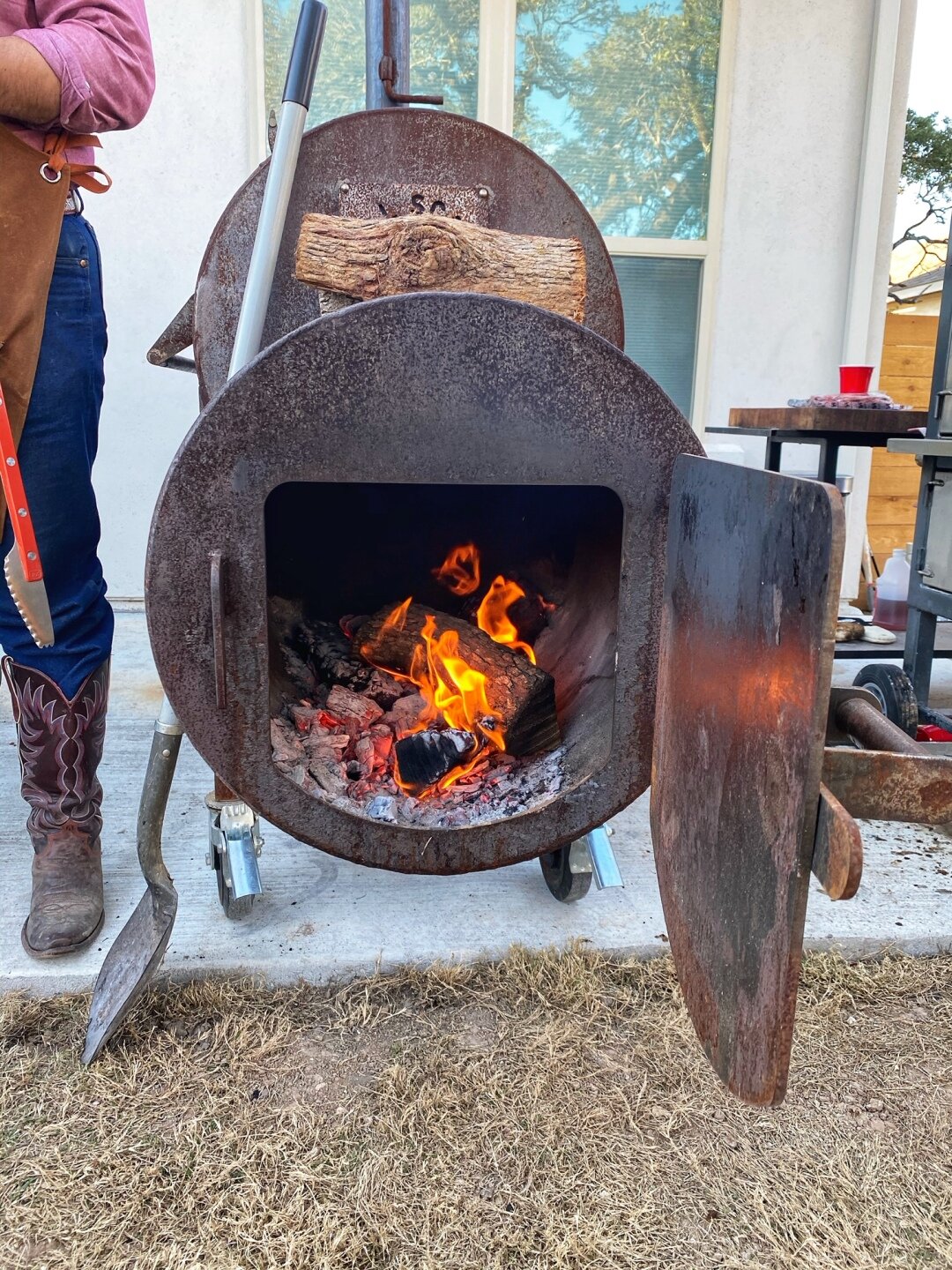 How do I keep my wood burning in my smoker?