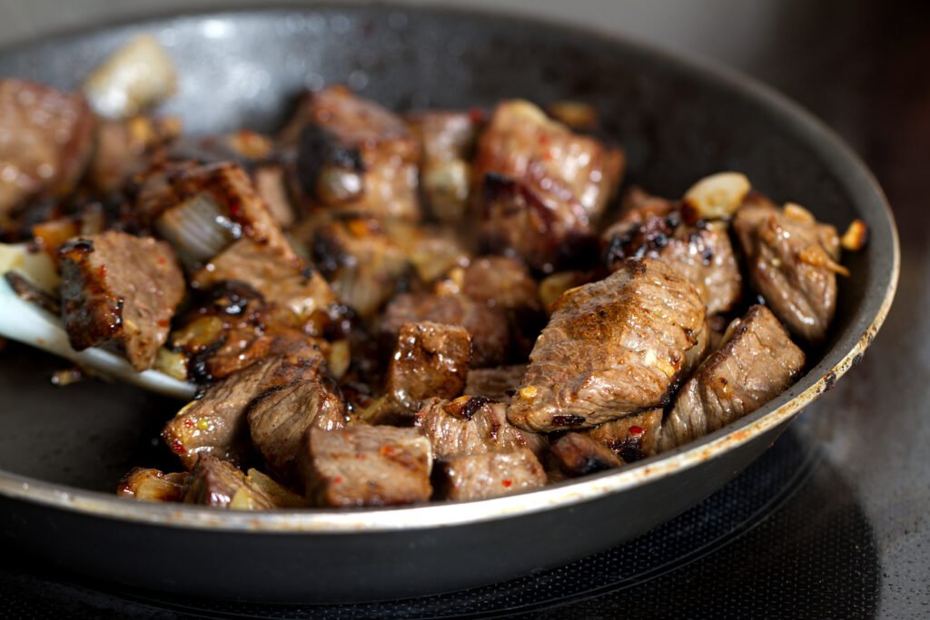 How do you cook beef cubes and make them tender?