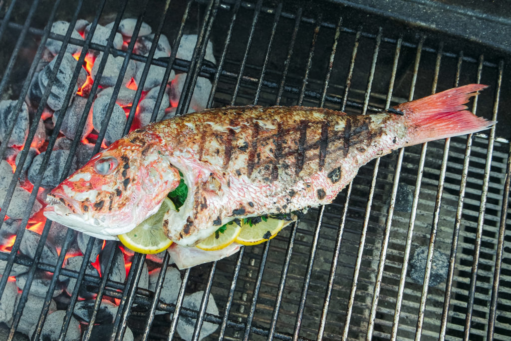 How do you cook fish on a charcoal grill?