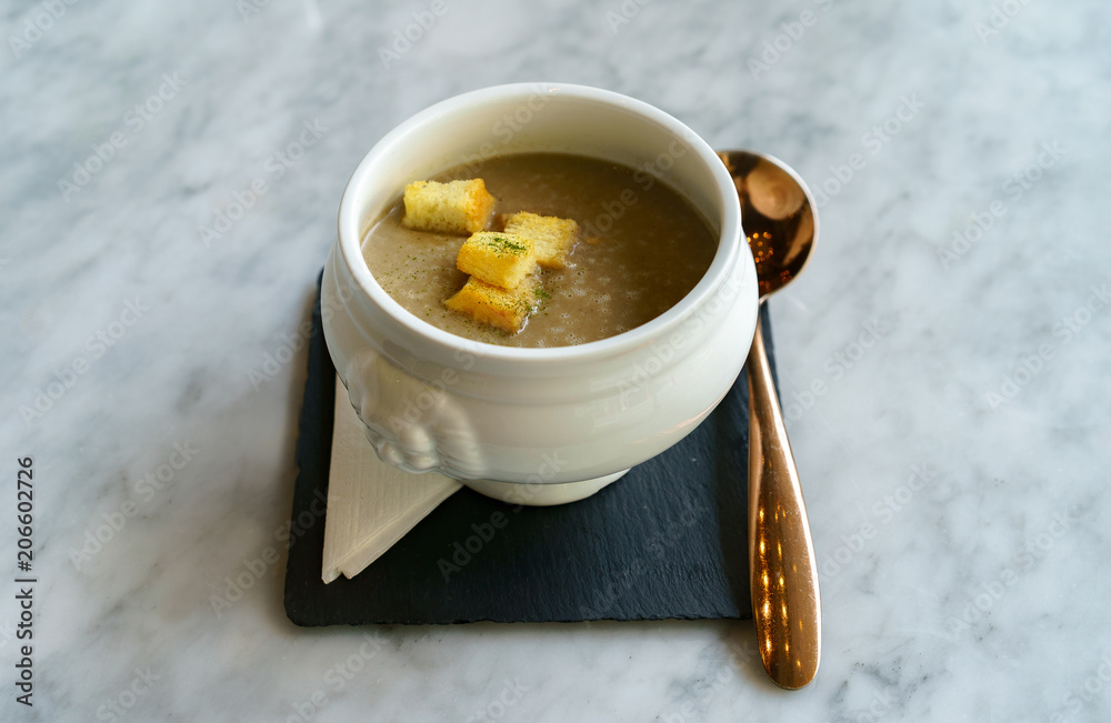 How do you eat from a cream soup bowl?
