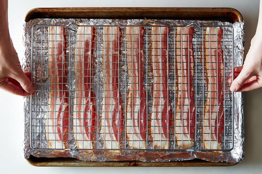 How do you keep bacon flat when baking?
