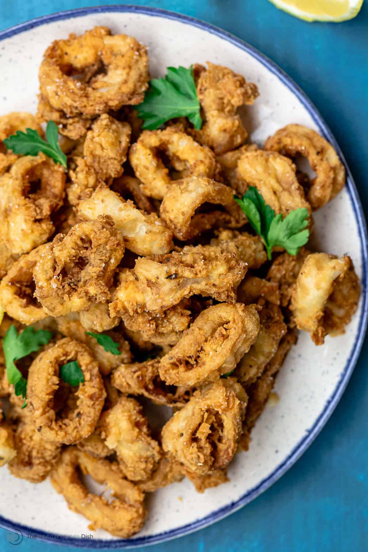 How do you make batter stick to calamari?