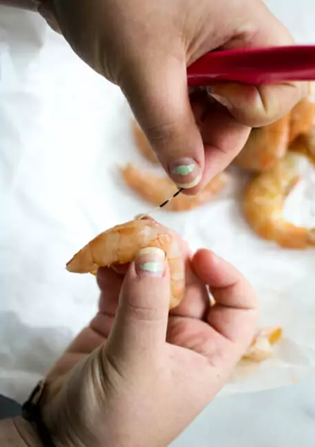 How do you remove poop shoot from cooked prawns?