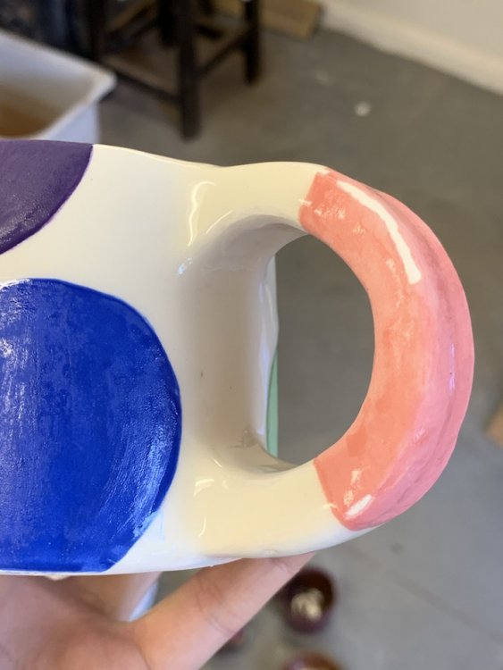 How do you remove underglaze from a bisque?