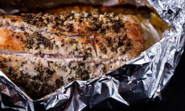 How do you wrap meat in foil when cooking?