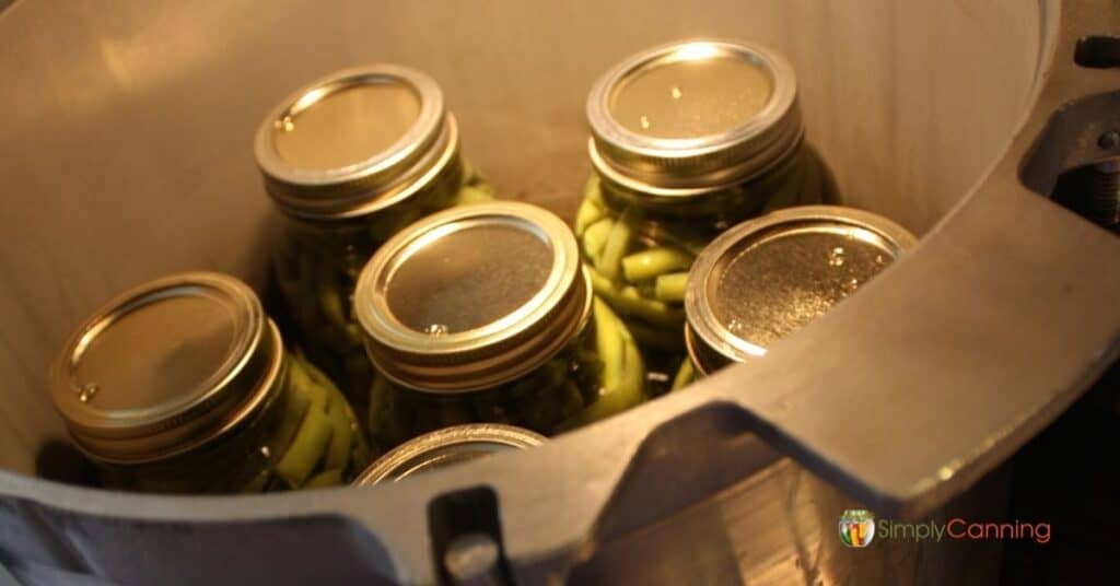 How long do you leave jars in a pressure cooker?