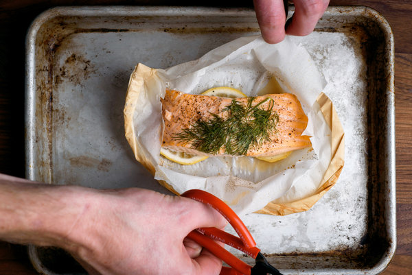 Is it better to cook salmon on foil or parchment paper?