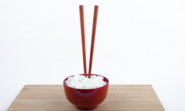 Is it rude to put chopsticks in food?