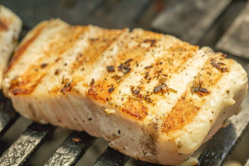 Should I flip halibut on the grill?