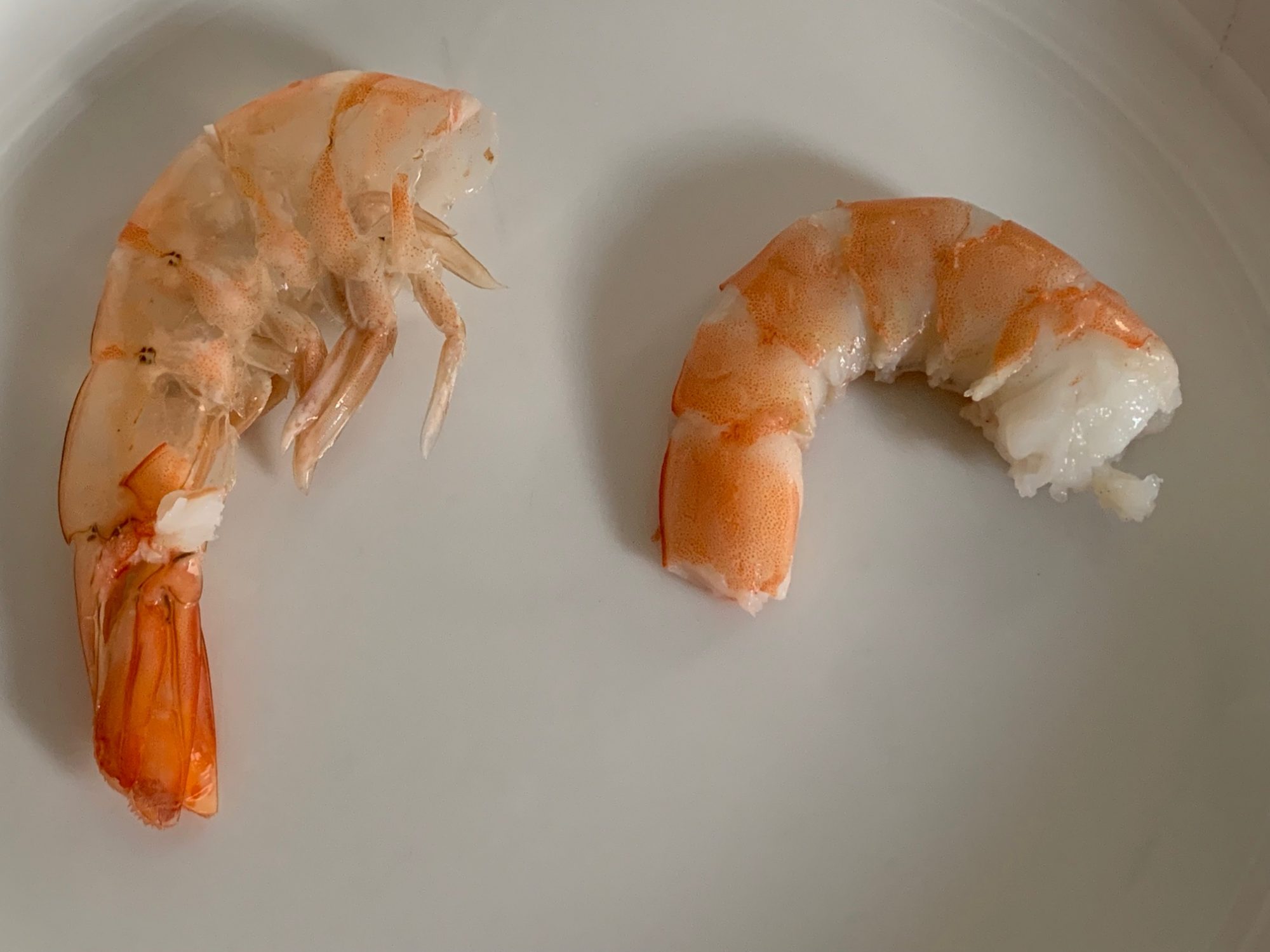 Should shrimp be peeled before cooking?