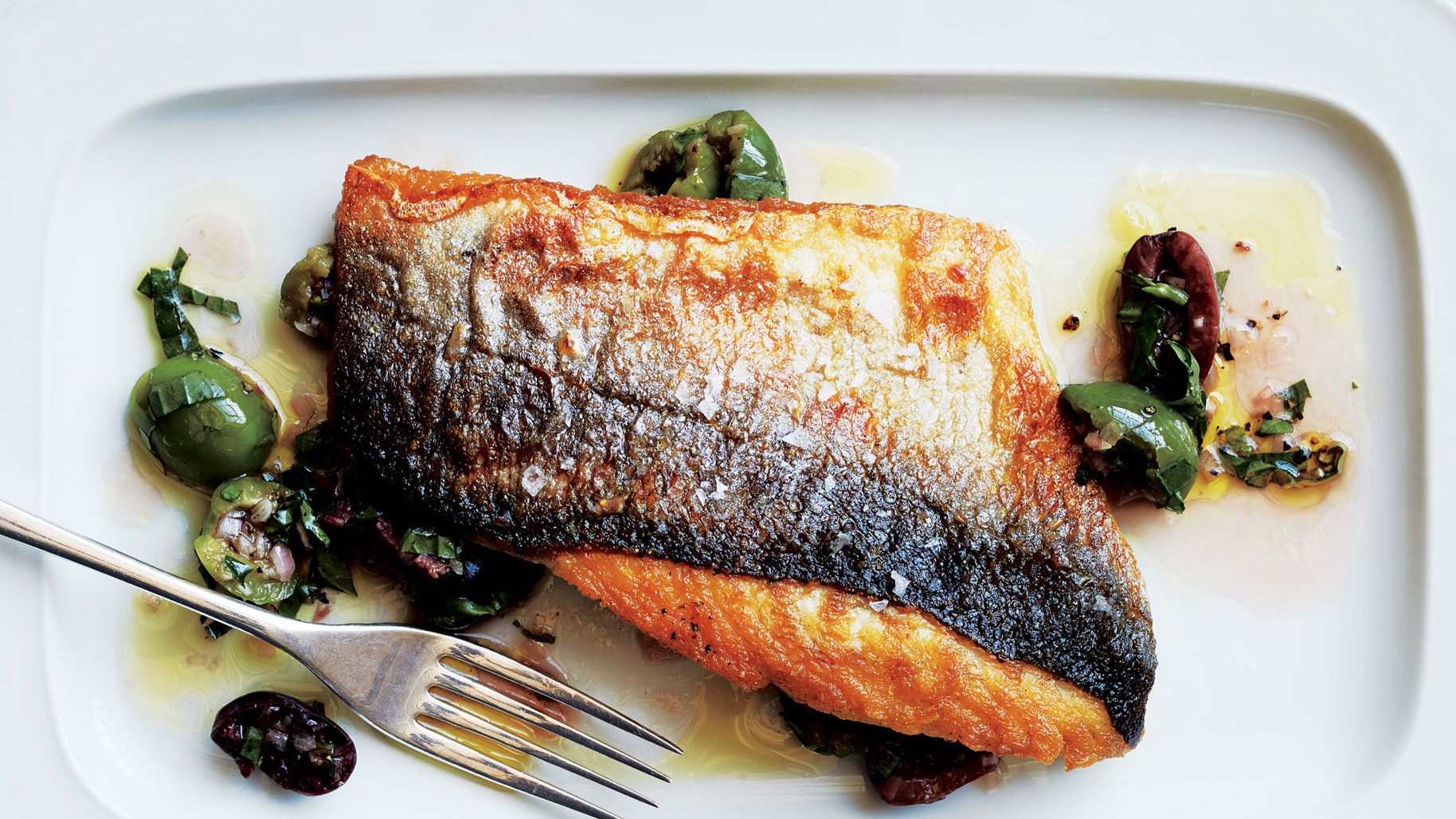 Should you leave the skin on fish when cooking it?