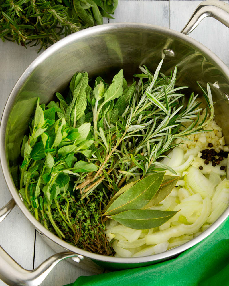 What herbs are generally added to stock broths for flavor?