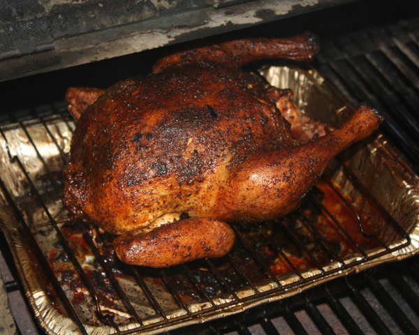What is the lowest temp to smoke a chicken?
