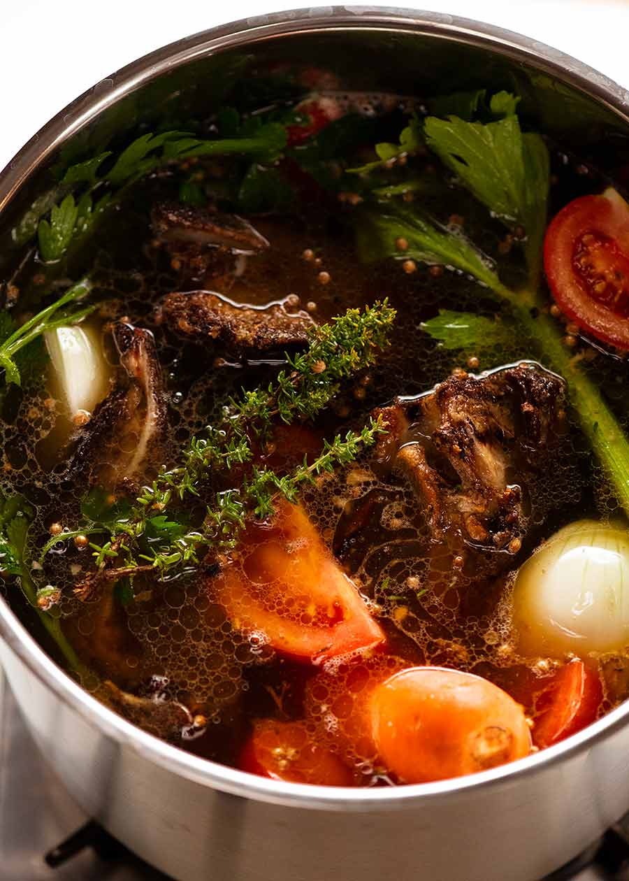 What is the recommended time for simmering beef stock?