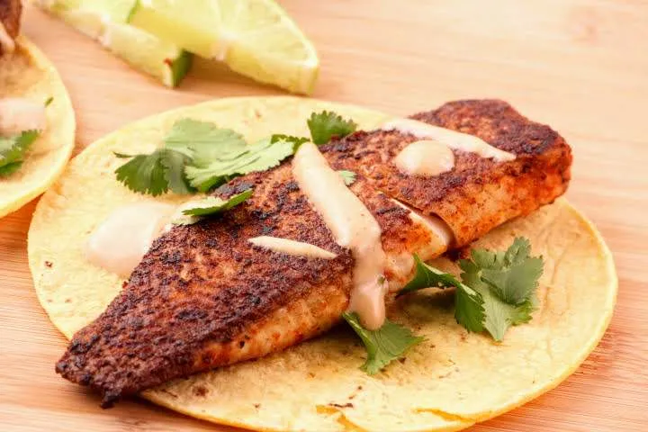 What temperature does tilapia need to be cooked to?