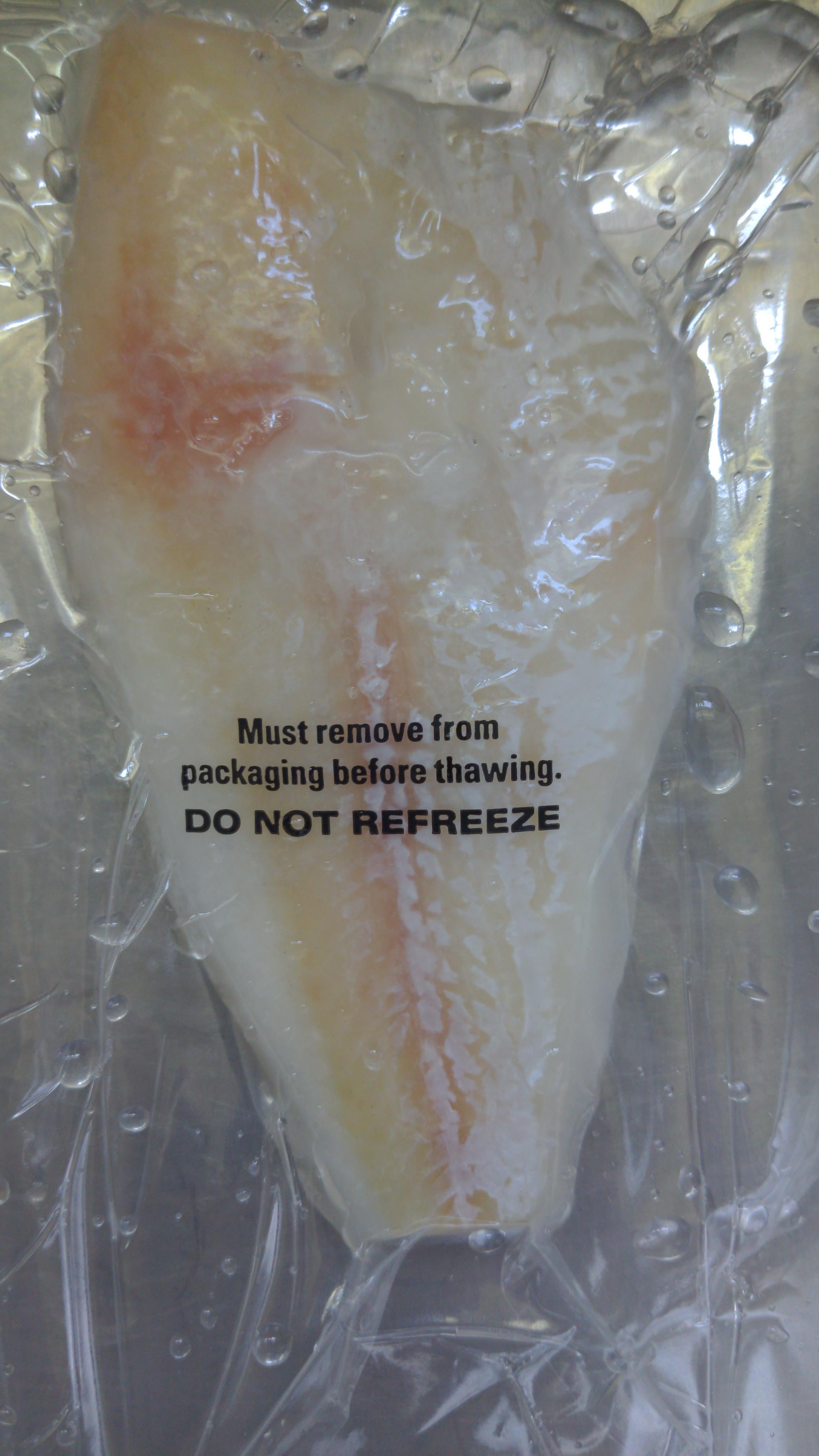 When thawing frozen fish that comes in vacuum sealed package the fish should be removed from its package Why?