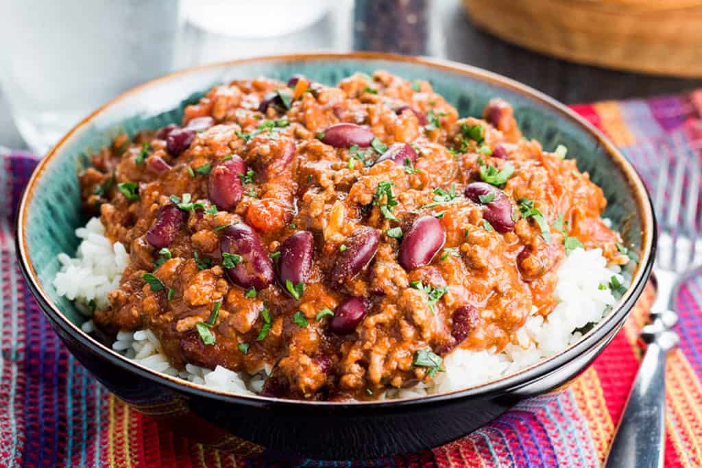 Where did chili con carne originate from?