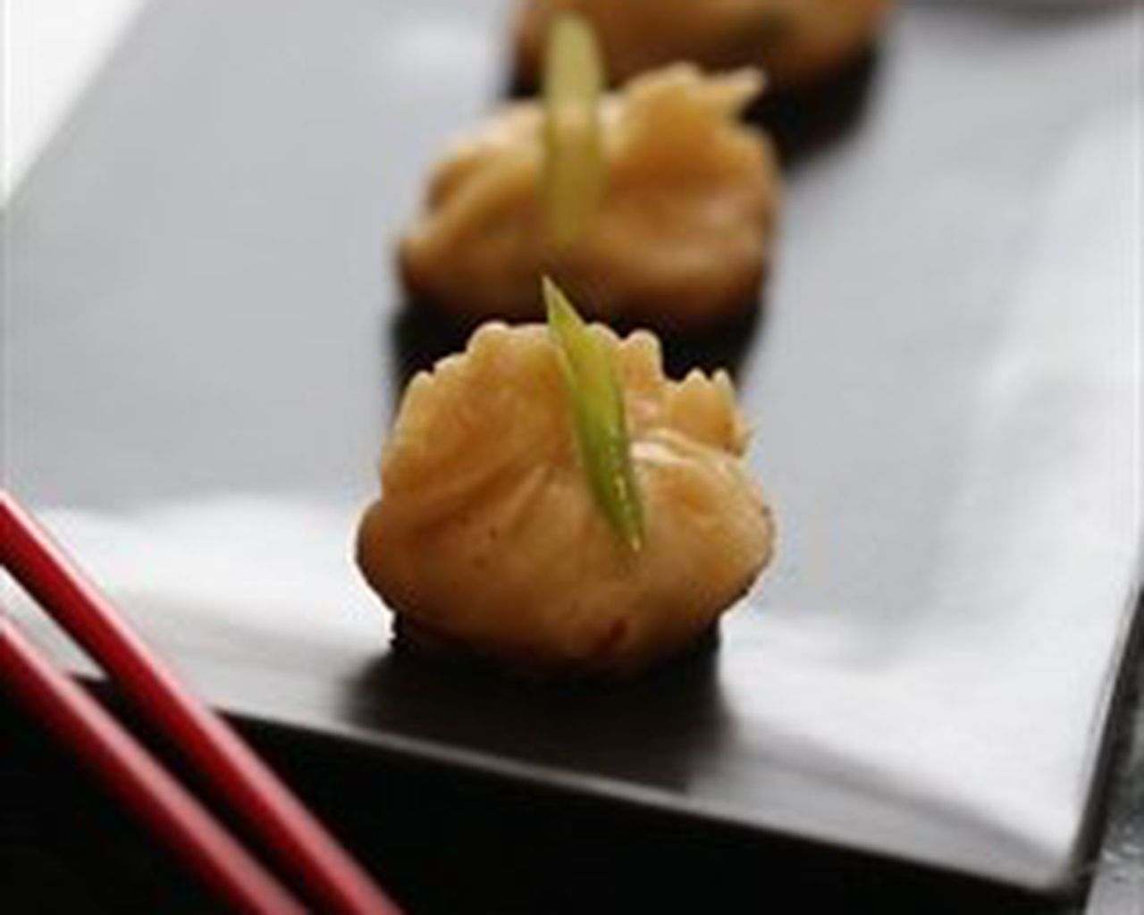 Why do dumplings represent wealth?