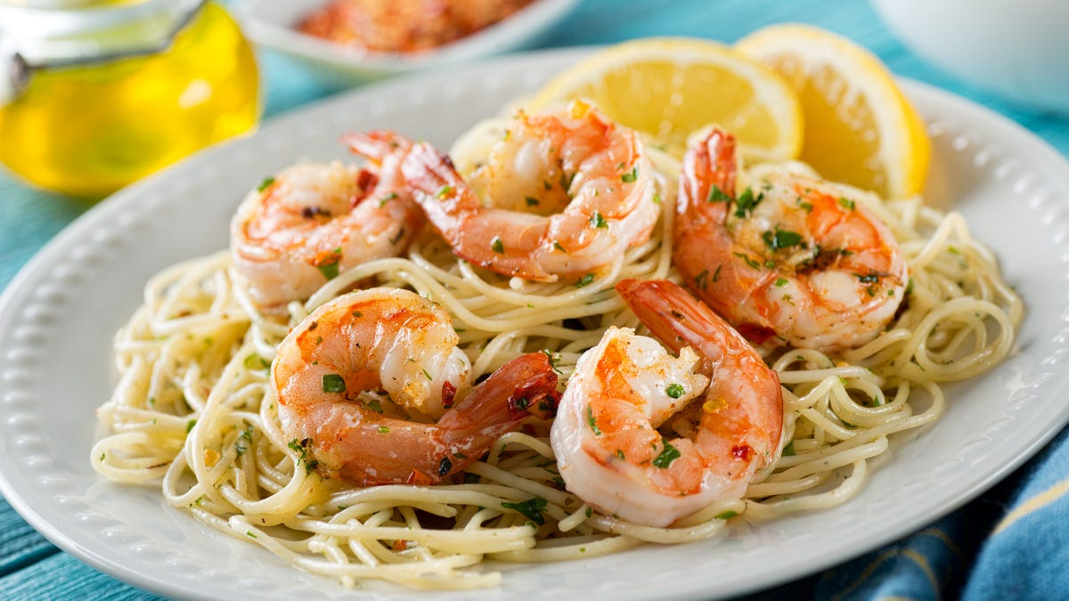 Why do restaurants leave tails on shrimp in pasta?