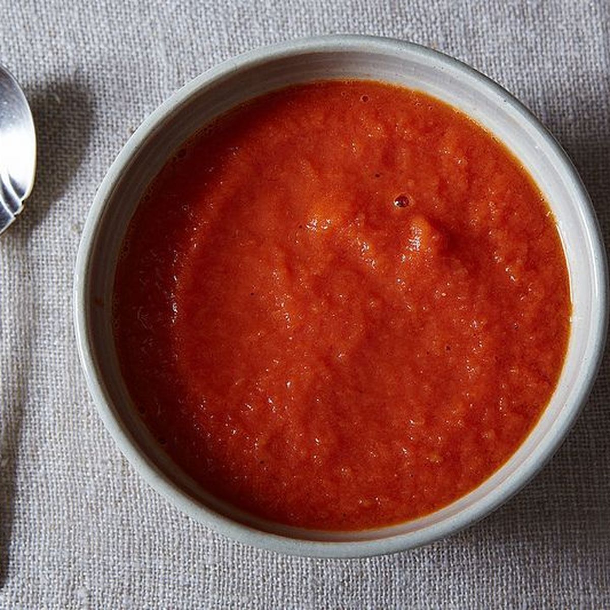 Why do you add baking soda to homemade tomato soup?