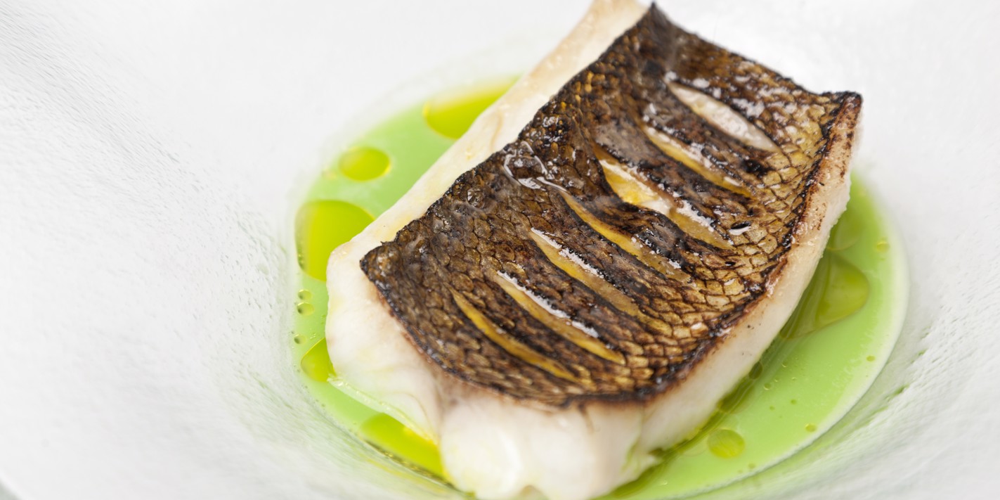 Why is grilling a good method of cooking for fillets of sea bass?