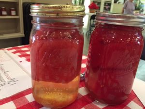 Why is there liquid at the bottom of my canned tomatoes?